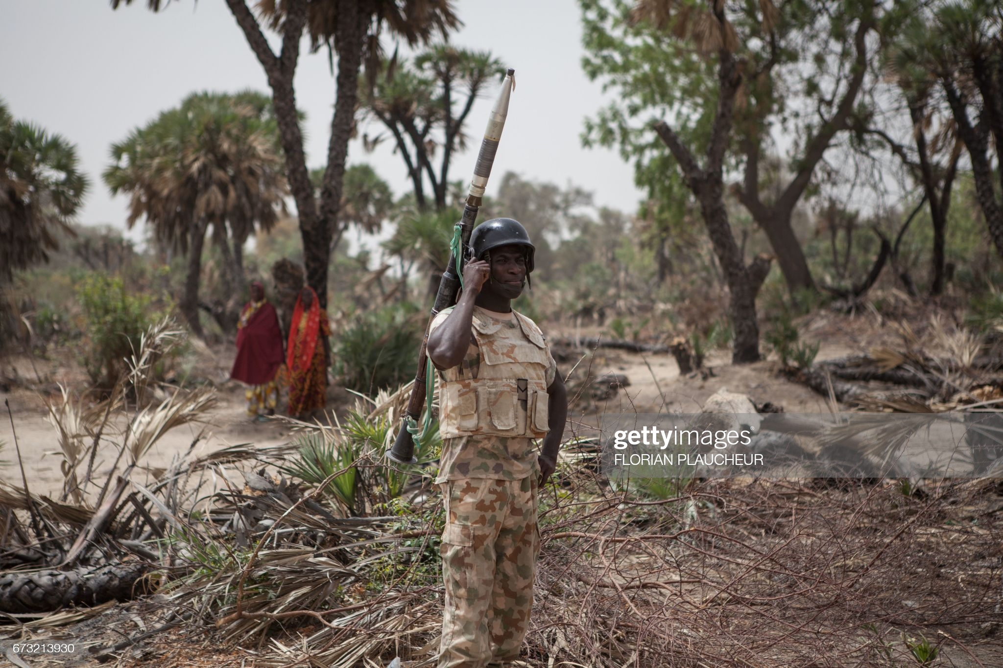 A Nigerian soldier with a rocket propelled grenade RPG stands guard on ...